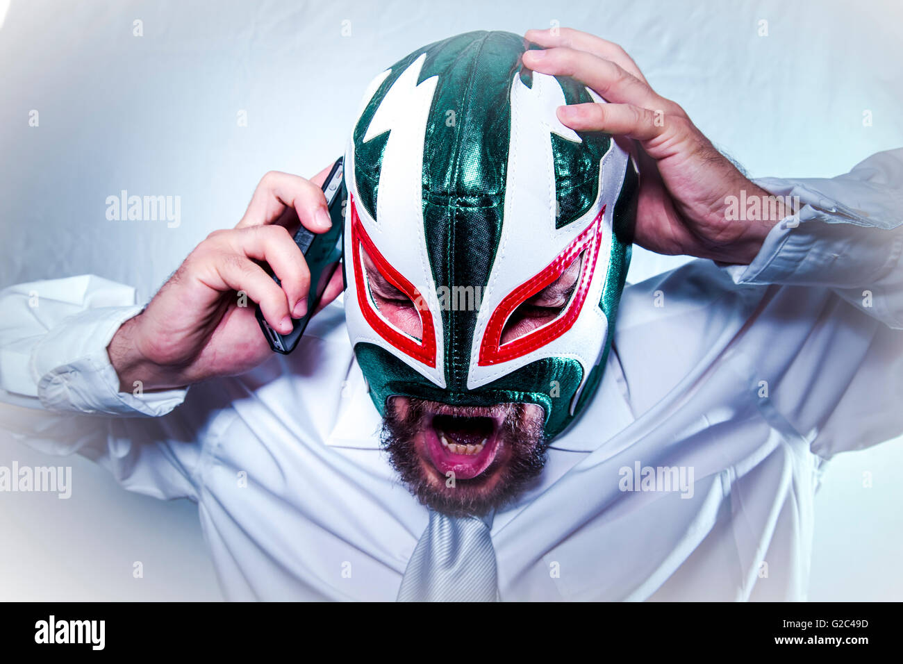 Headache, angry businessman with Mexican wrestler mask, expressions of ...