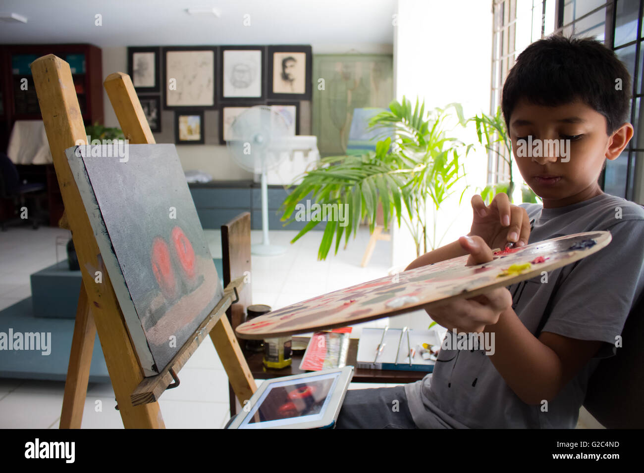 Little boy painting still life on a canvas Stock Photo - Alamy
