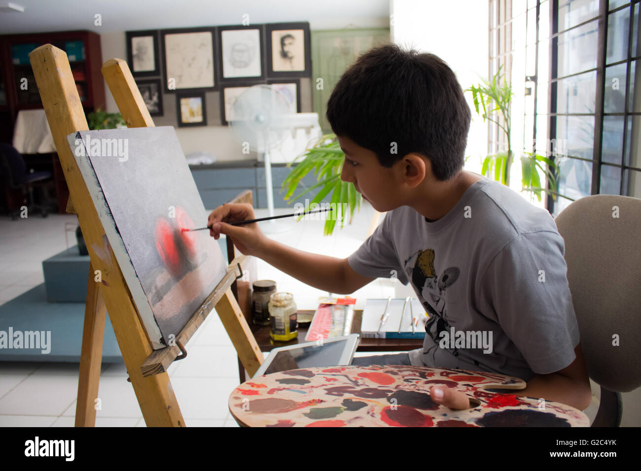 Little boy painting still life on a canvas Stock Photo - Alamy