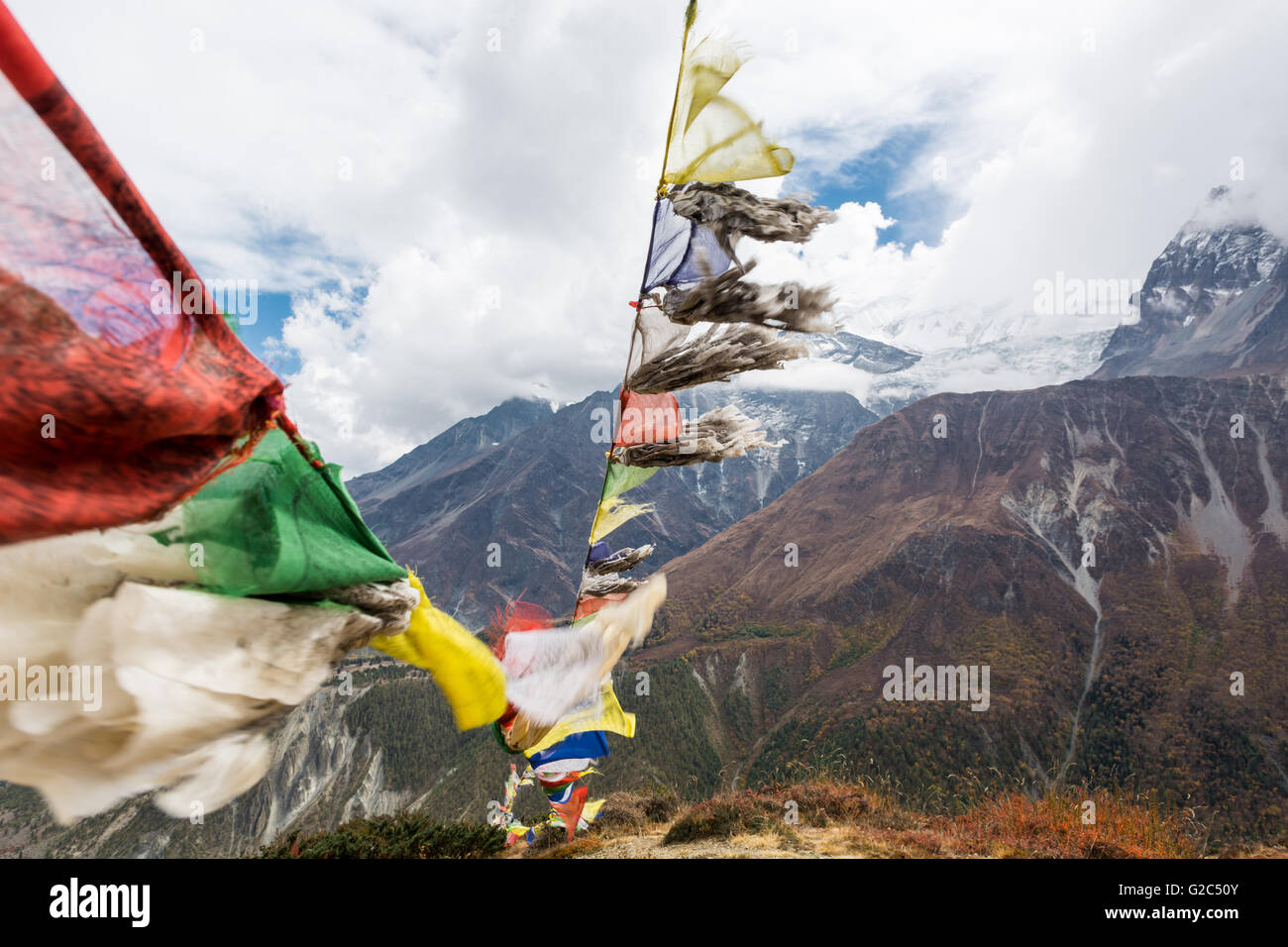 Buddhist praying flags blowing in the wind Stock Photo - Alamy