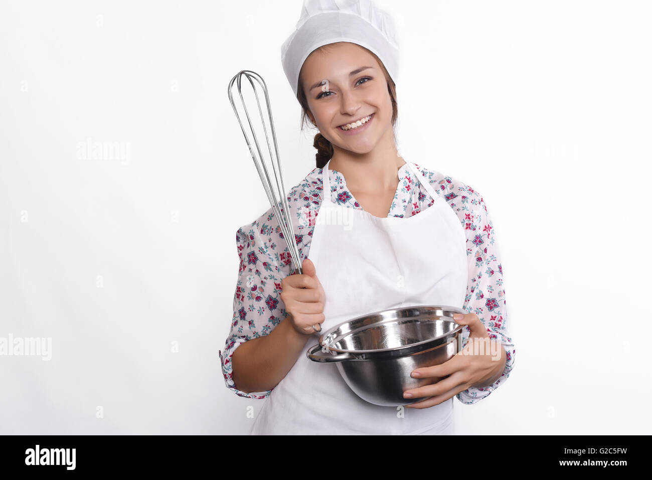Young beautiful woman cooking. Isolated white background Stock Photo ...