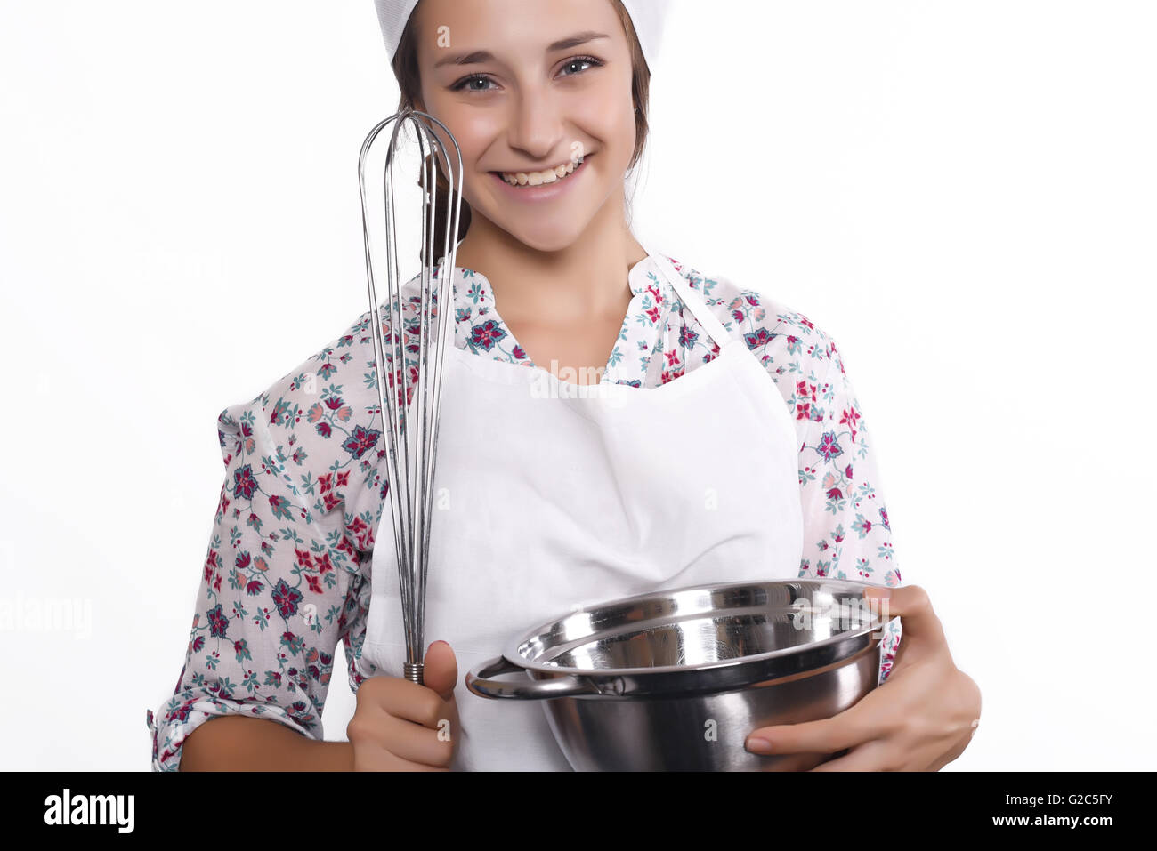Young beautiful woman cooking. Isolated white background Stock Photo ...
