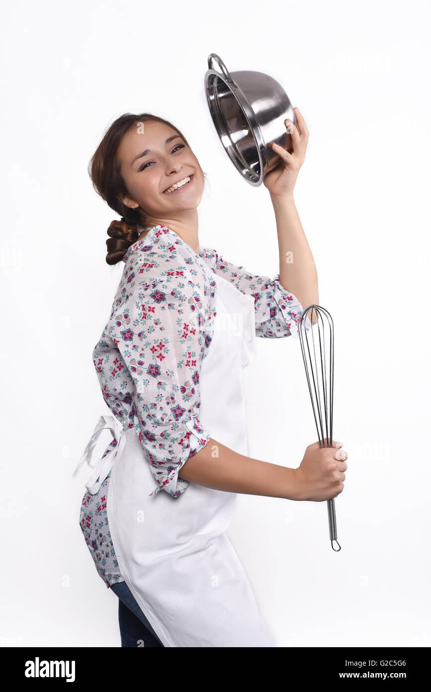 Portrait of young beautiful chef having fun. Isolated white background ...