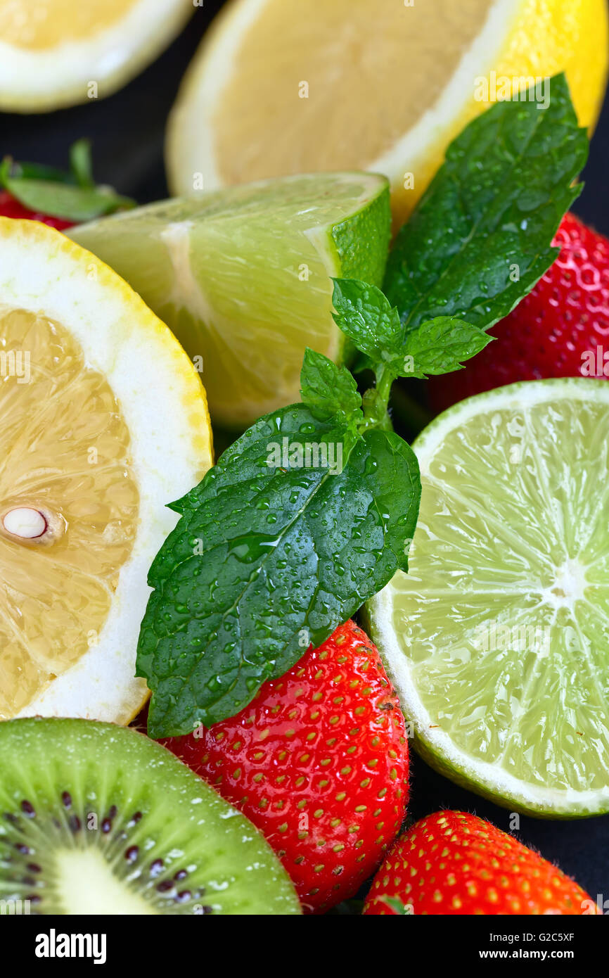 The ripe juicy fruits and peppermint leaves Stock Photo - Alamy