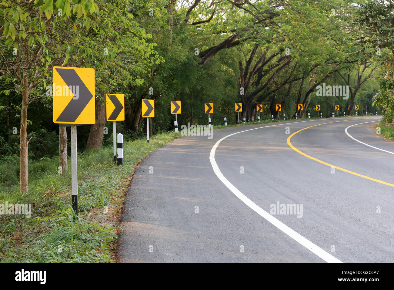 The road curve with street signs reflex light,At night you can see the ...