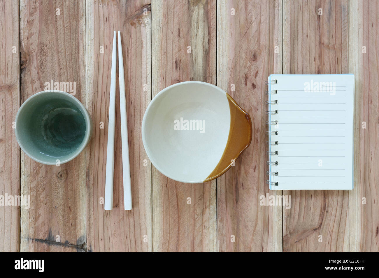 kitchen utensils and note book on wood background for design Concept in ...