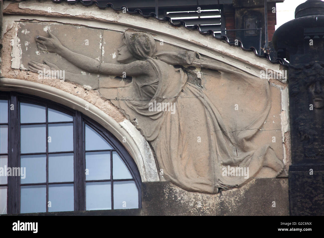 Prayed woman depicted on the Art Nouveau building of the Main Railway ...