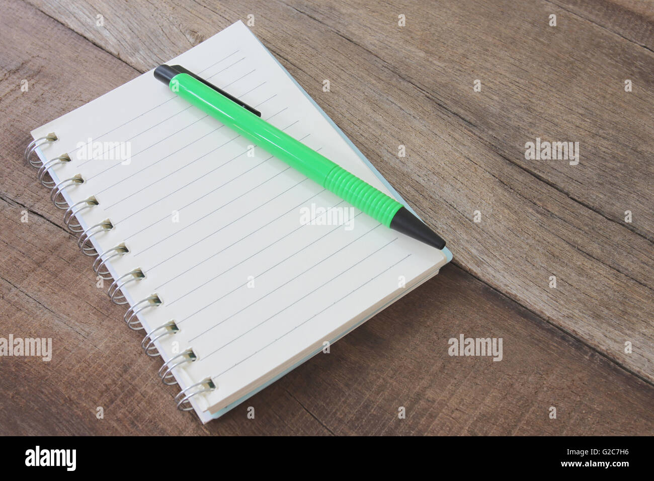 Blank notebook and pen color on wooden floor for design background ...