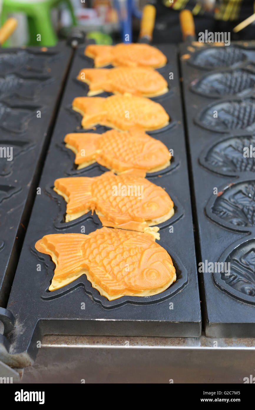 Sweet dessert with shape fish on the oven in the market Stock Photo - Alamy