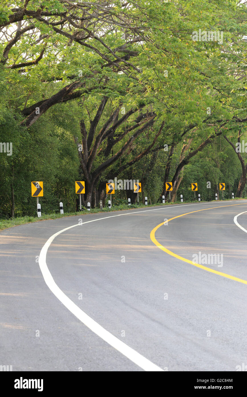 The road curve with street signs reflex light,At night you can see the ...