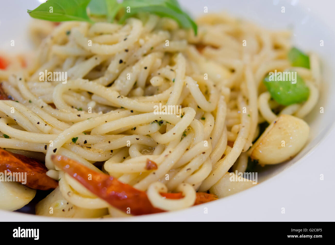 spagetti seafood spicy on wood table Stock Photo - Alamy
