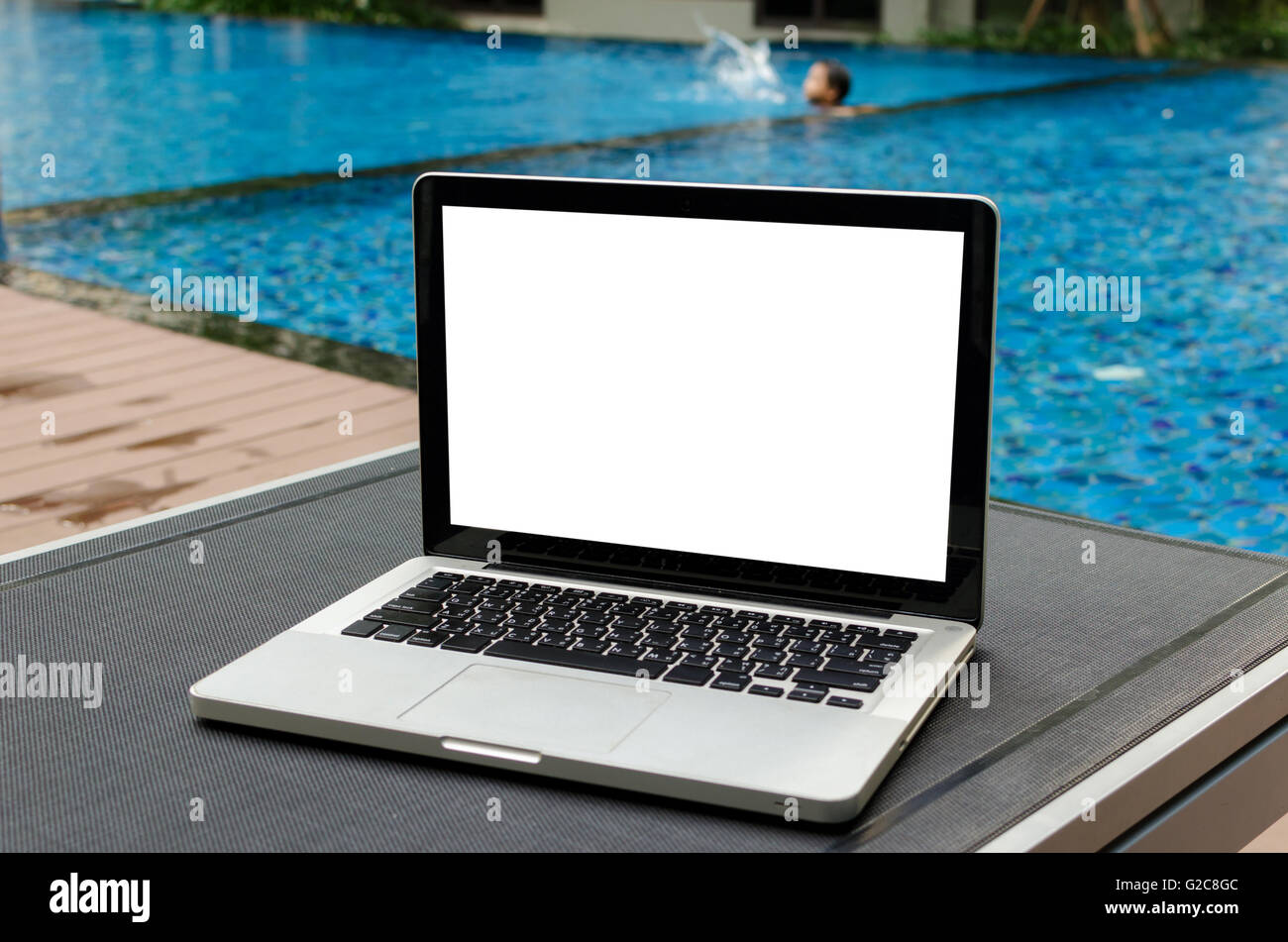 a laptop on the deckchair in swimming pool Stock Photo - Alamy