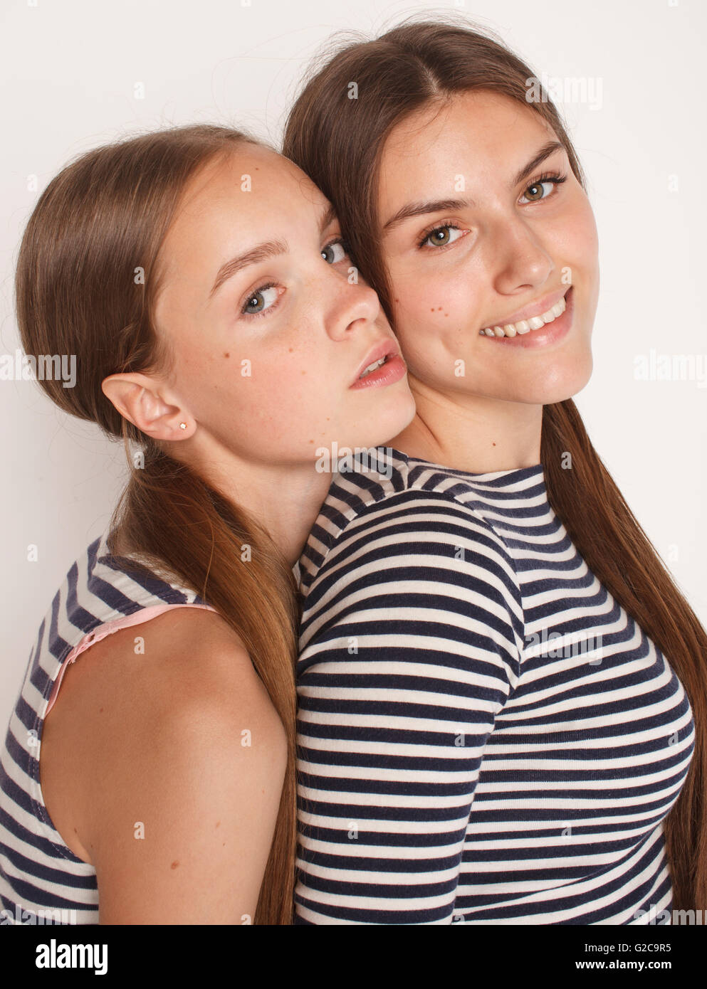 two cute teenagers having fun together isolated on white Stock Photo ...