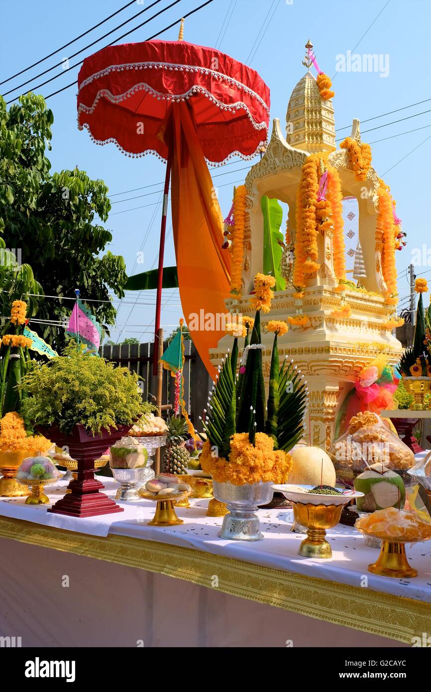 Offerings of food and flowers at spirit house establishing ceremony ...