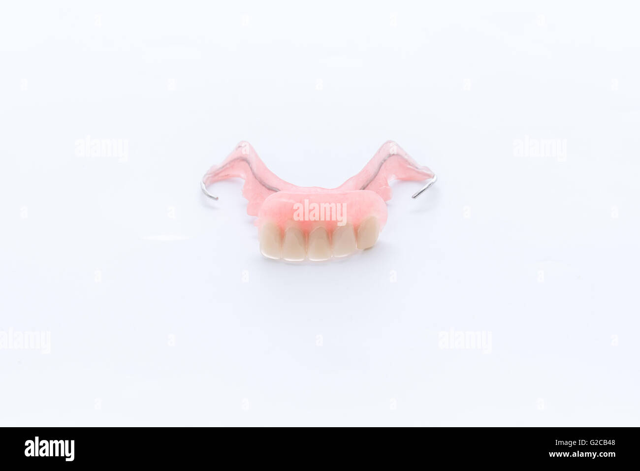 dentures on white background Stock Photo - Alamy