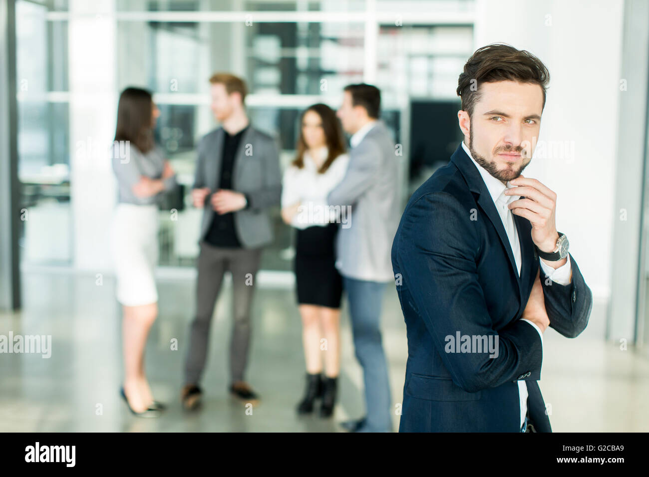 View of the businessman posing in the office Stock Photo - Alamy