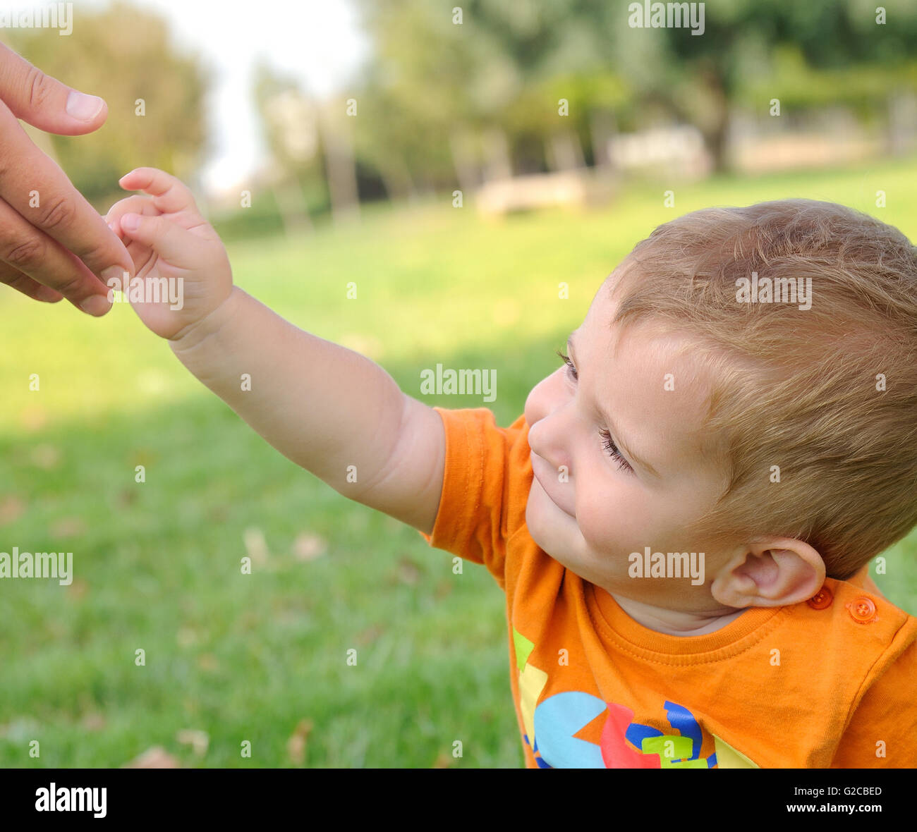 Father hand holding child hi-res stock photography and images - Alamy