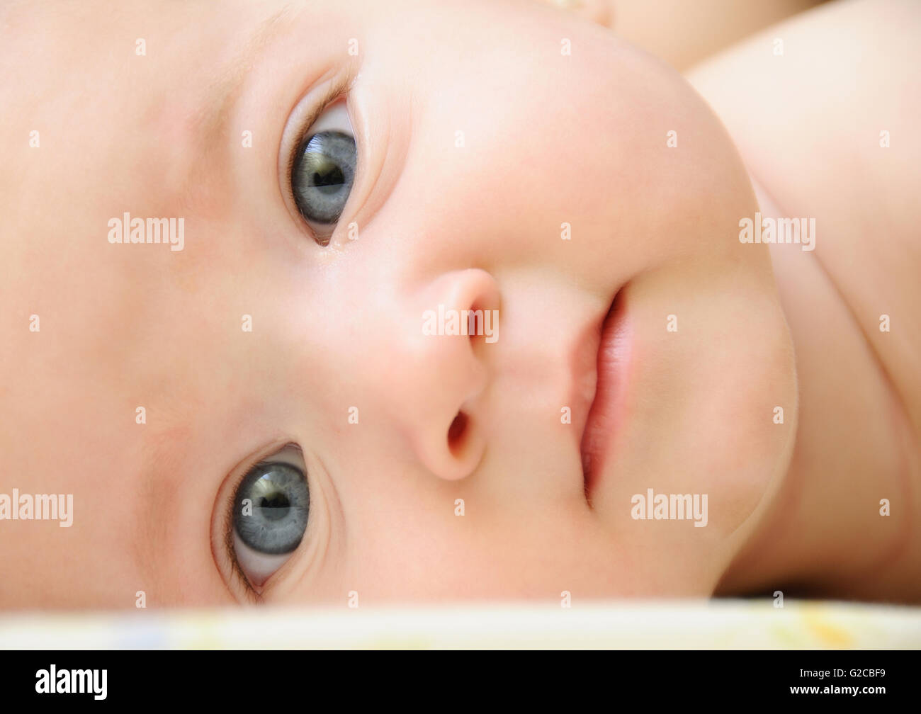 sharp-eyed baby lying in his cradle Stock Photo - Alamy