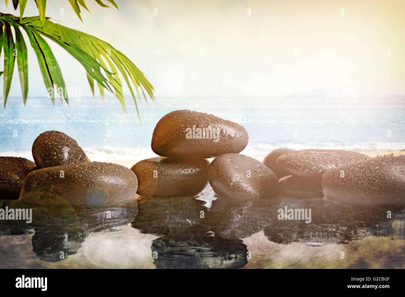 Group of stones with drops and calm water. Beach background with sun ...