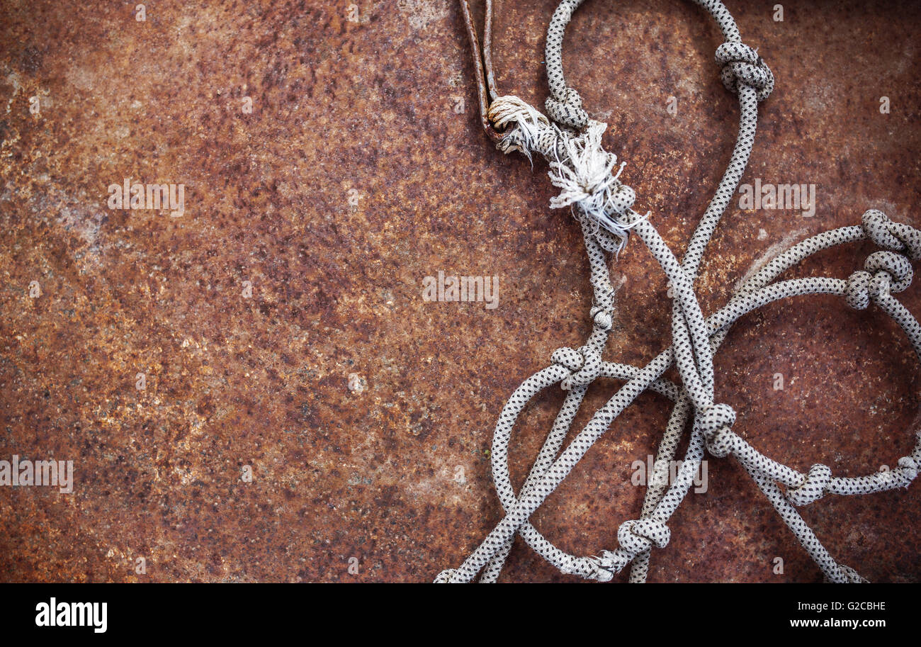 Old Hemp rope on rusty metal background Stock Photo - Alamy