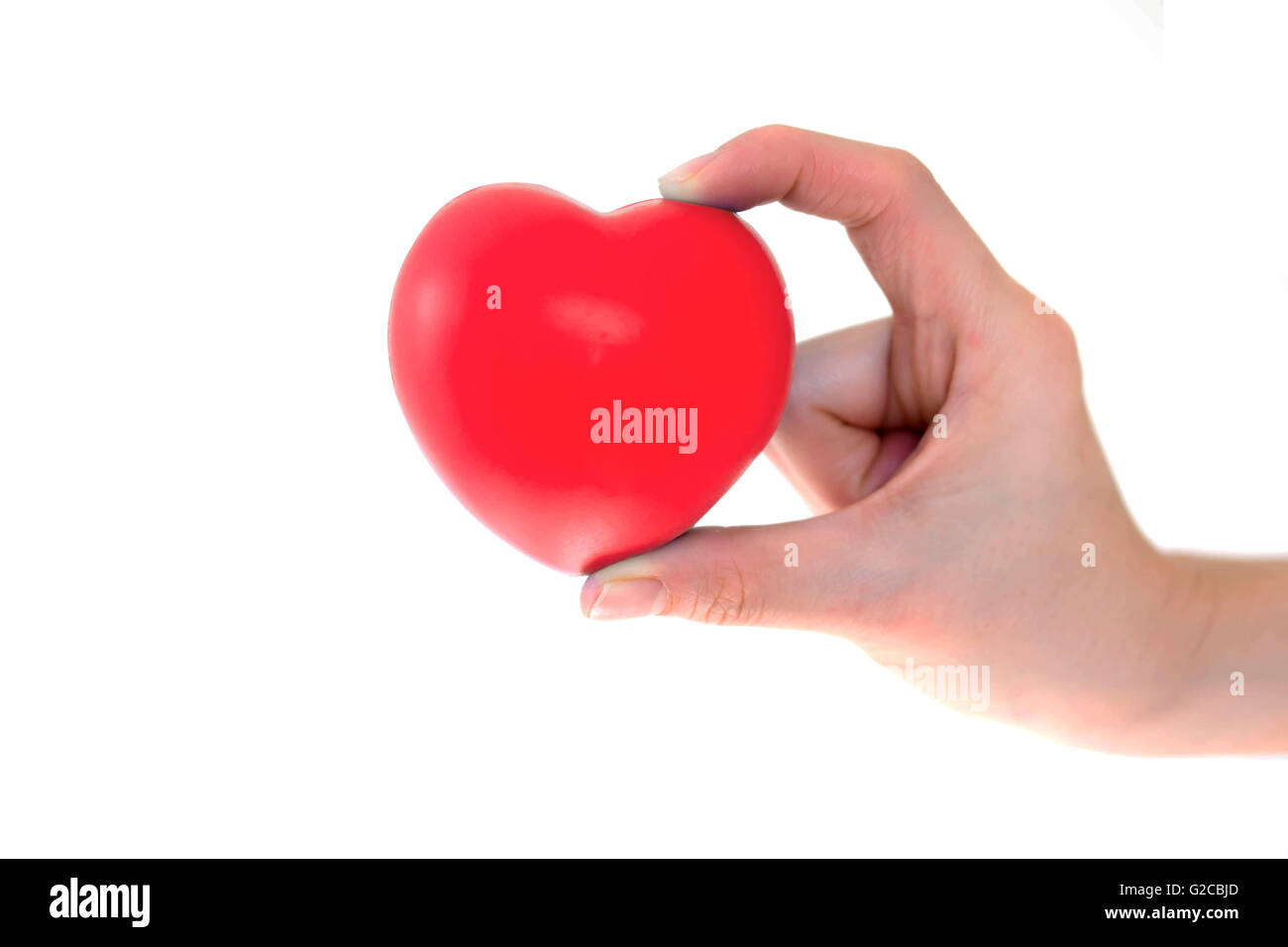 Heart in the hands isolated Stock Photo - Alamy