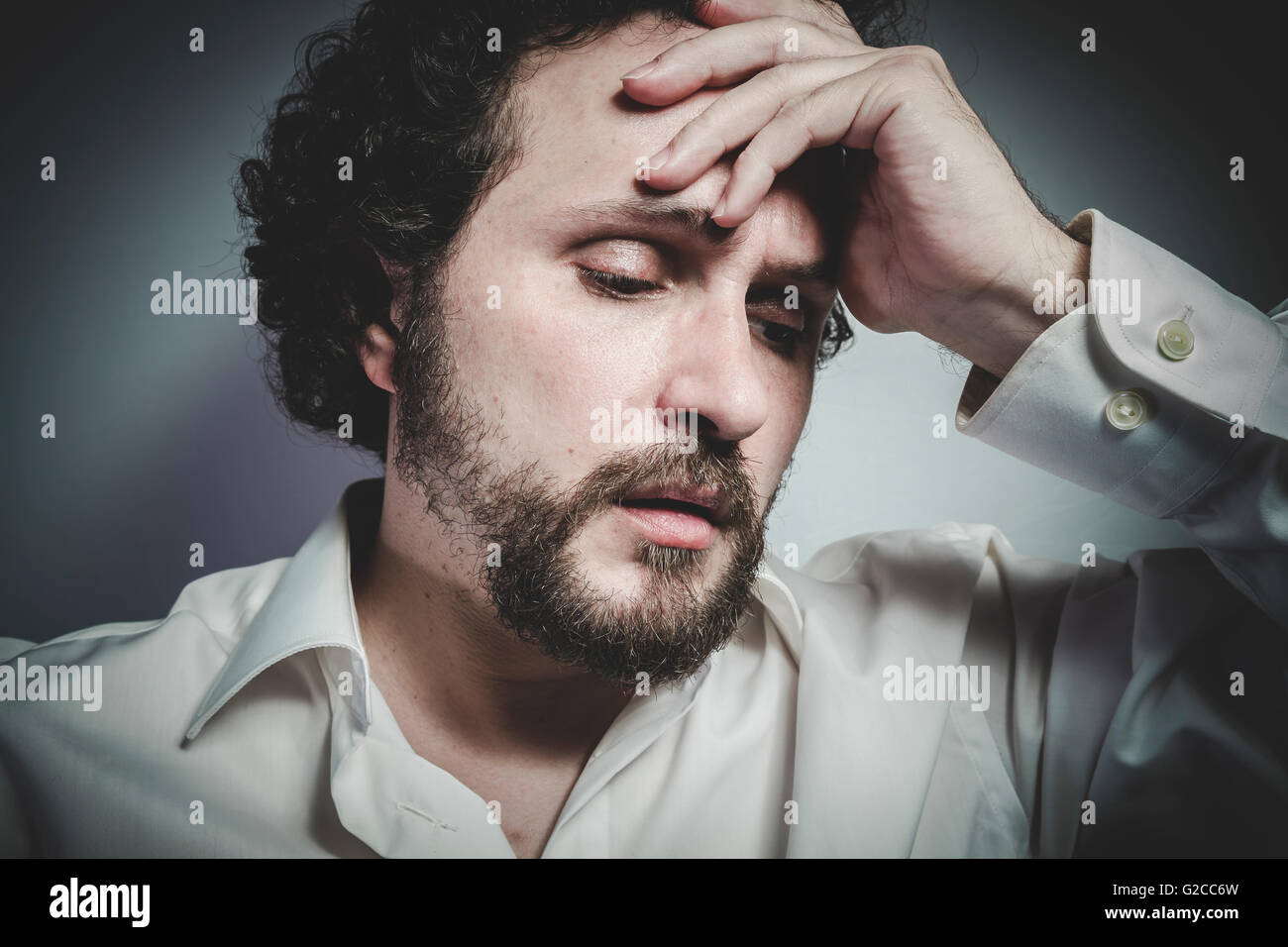 sad face, man with intense expression, white shirt Stock Photo - Alamy