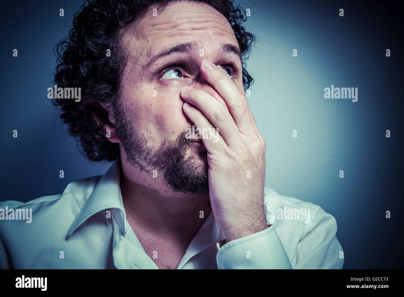 sad face, man with intense expression, white shirt Stock Photo - Alamy