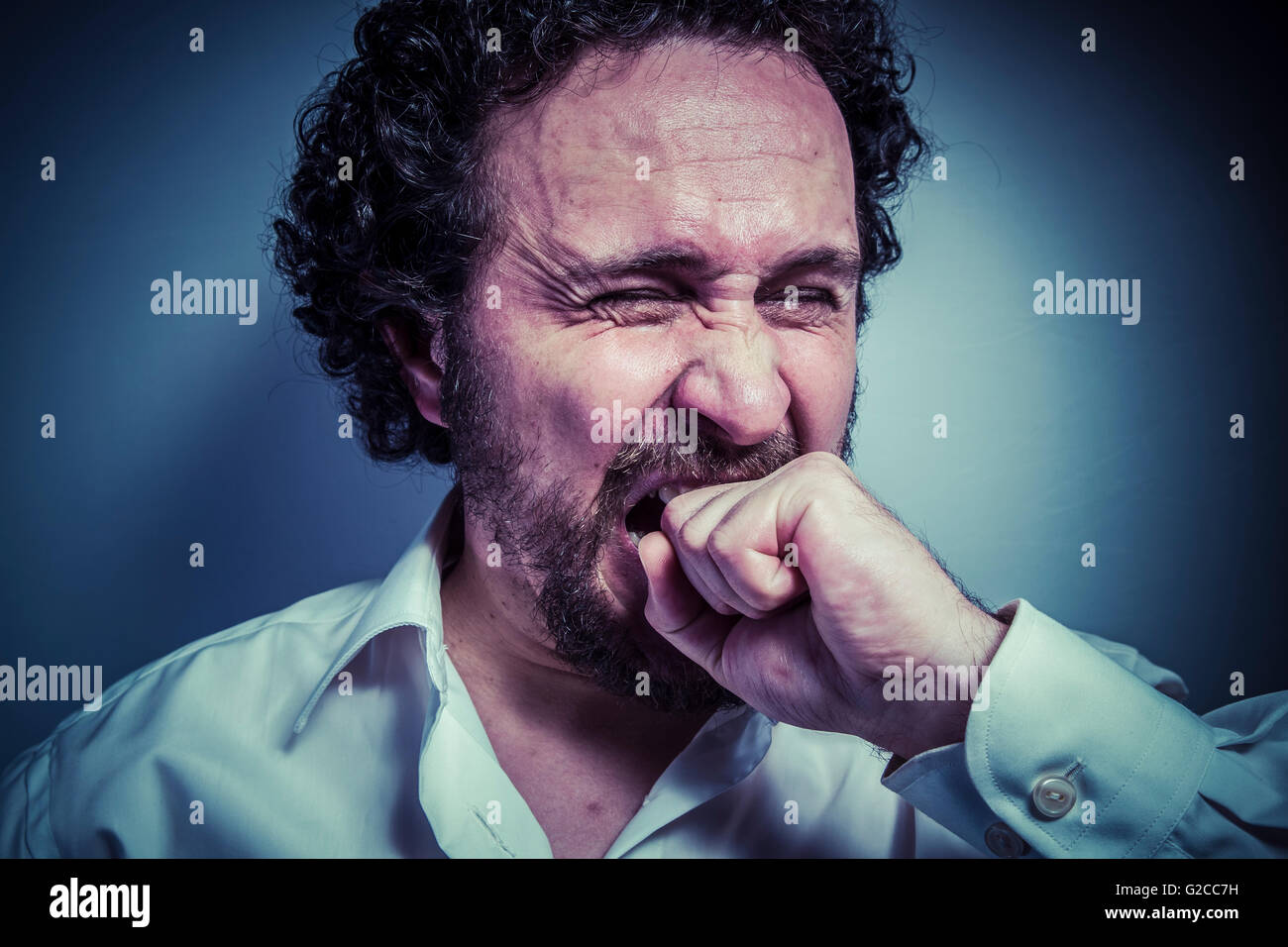 derision, man with intense expression, white shirt Stock Photo - Alamy