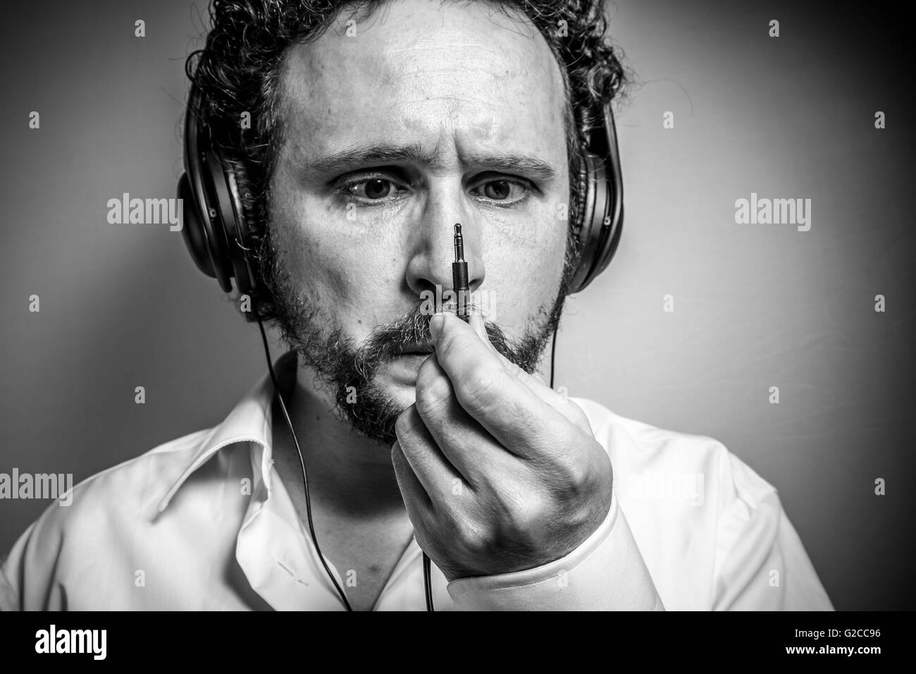 Funny, man with intense expression, white shirt Stock Photo - Alamy