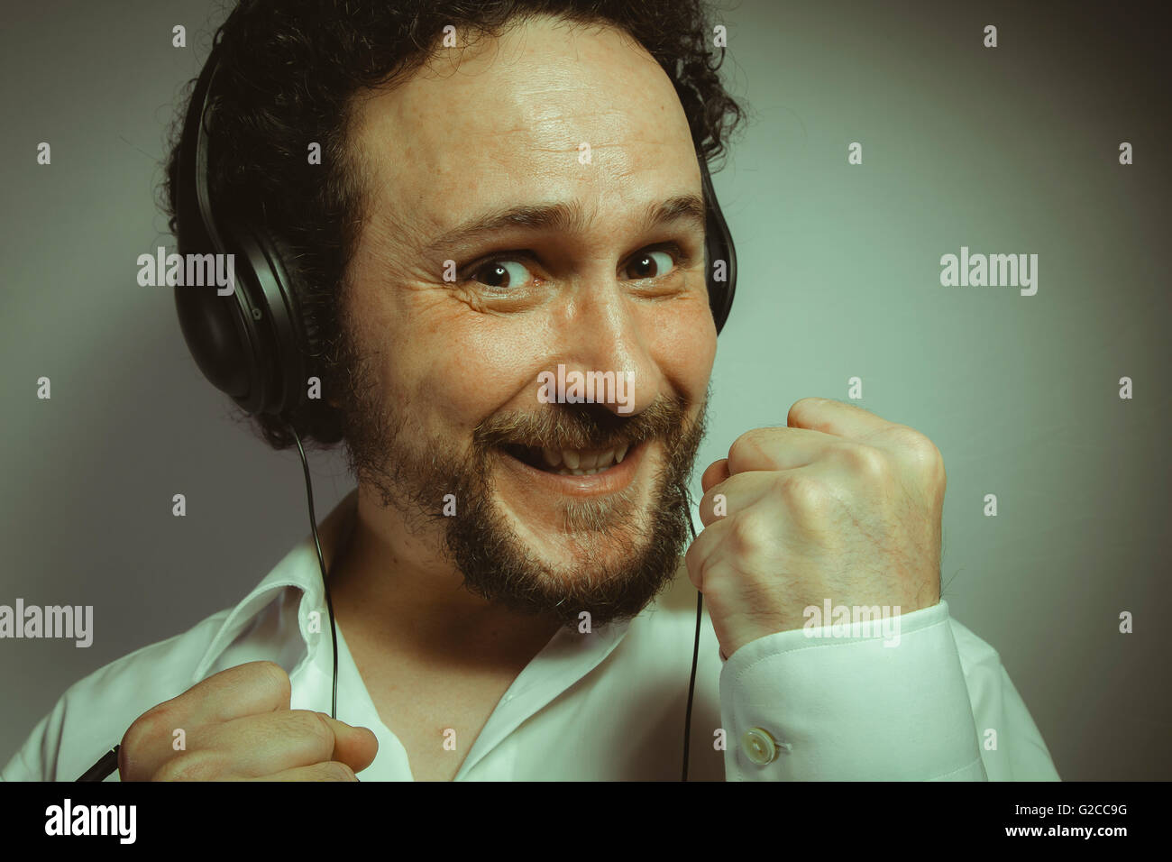 Funny, man with intense expression, white shirt Stock Photo - Alamy