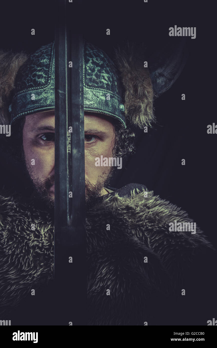 War, Costume, Viking warrior with a huge sword and helmet with horns ...