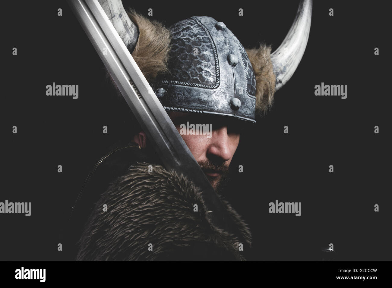 Evil, Viking warrior with iron sword and helmet with horns Stock Photo ...