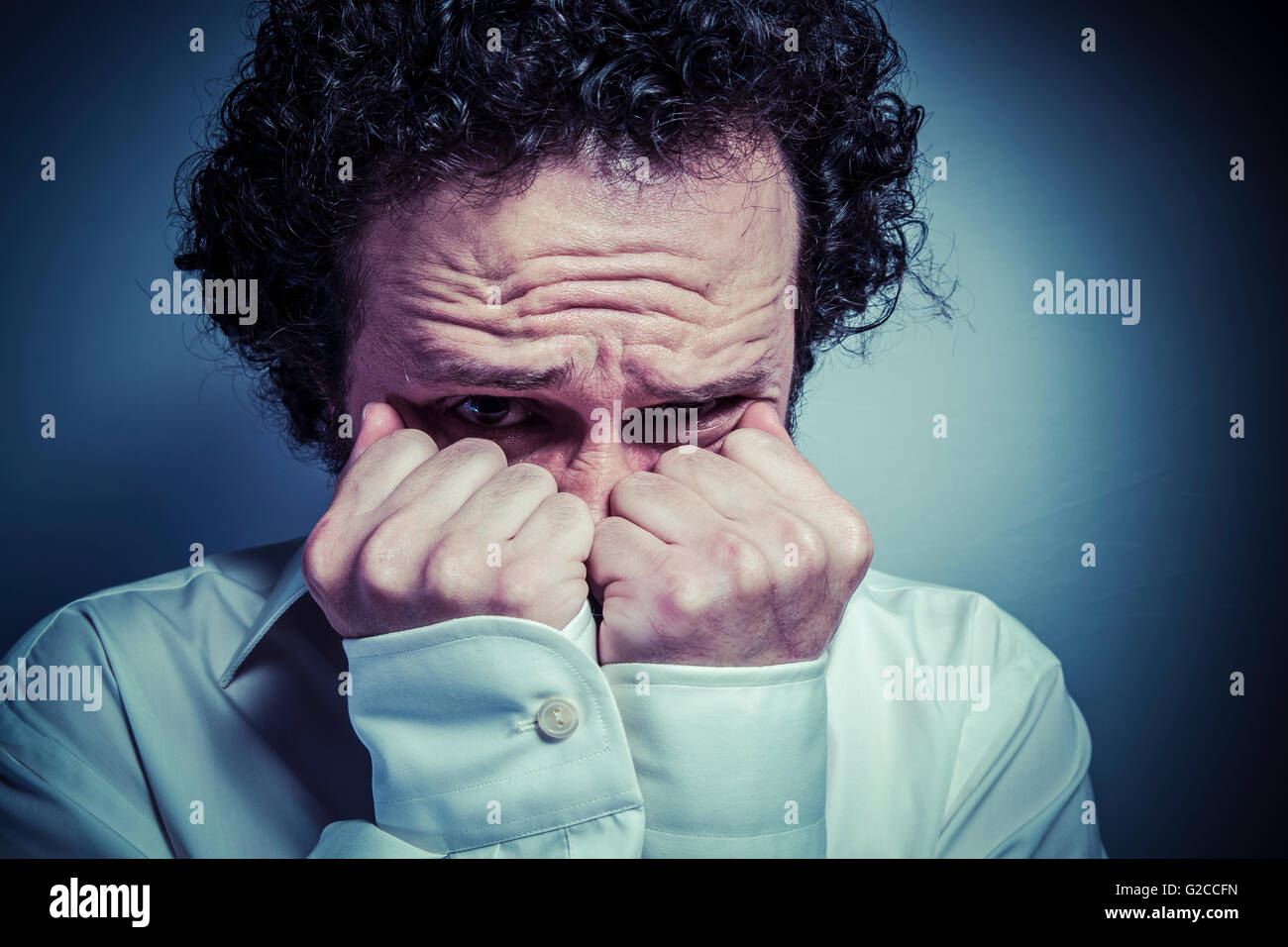 Fear, man with intense expression, white shirt Stock Photo - Alamy