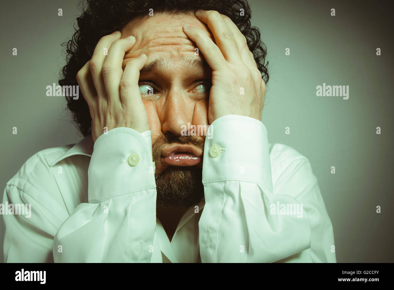 imagination and madness, man with intense expression, white shirt Stock ...