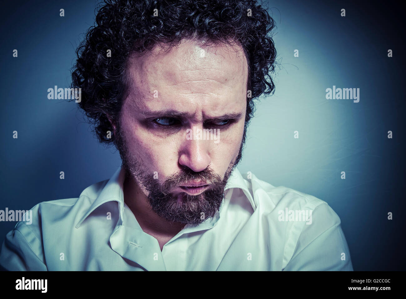 sad face, man with intense expression, white shirt Stock Photo - Alamy