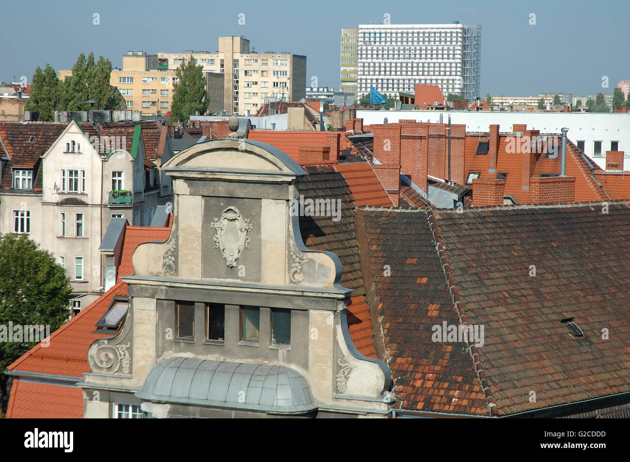Tiled roofs, chimneys and windows on old buildings in Poznan in Poland ...