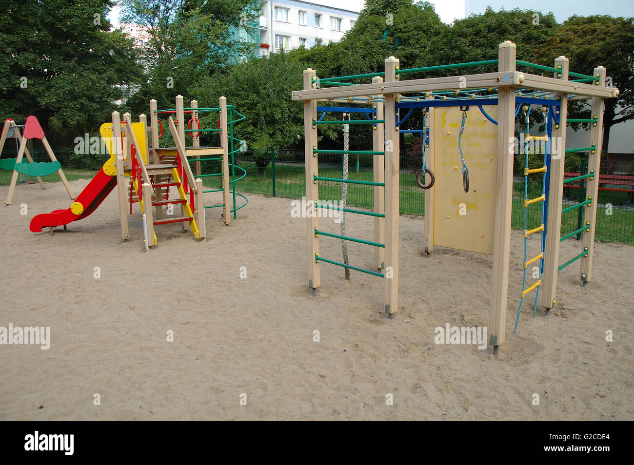Colorful playground on sand Stock Photo - Alamy