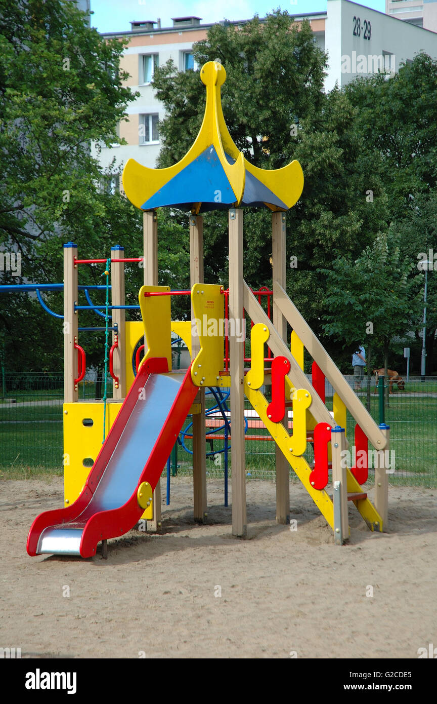 Colorful playground on sand Stock Photo - Alamy