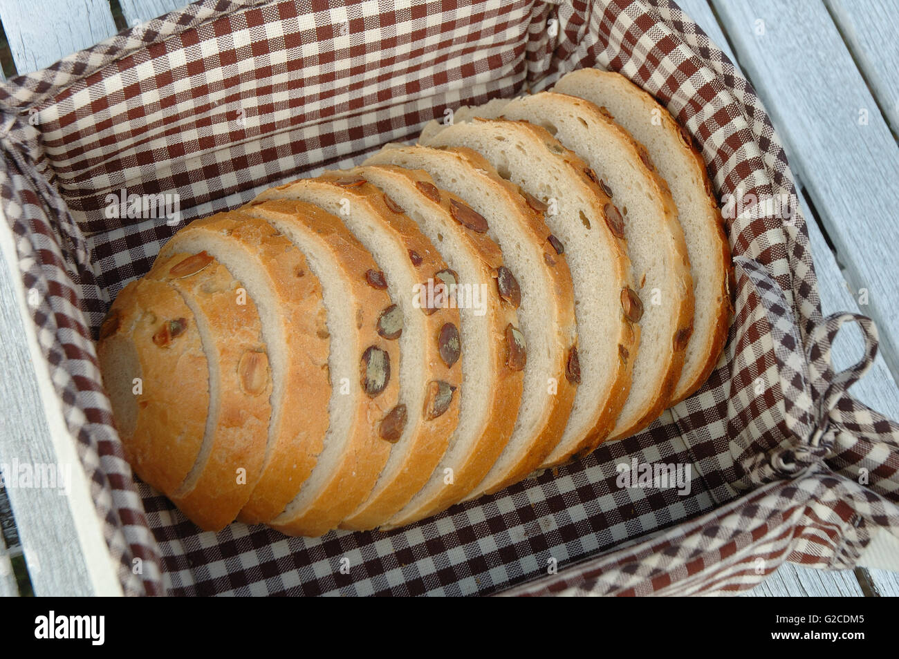 Slices of bread inside bread bin Stock Photo - Alamy