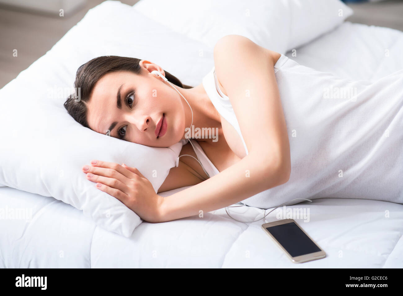 Pleasant beautiful woman resting in bed Stock Photo - Alamy