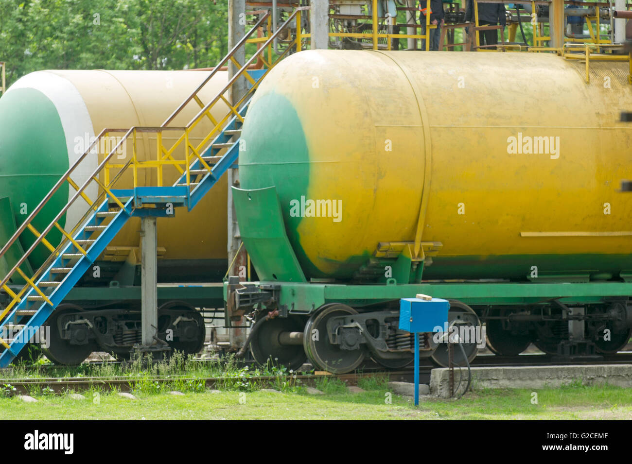 Old fuel tanks at the oil terminal on railway station on a summer day ...