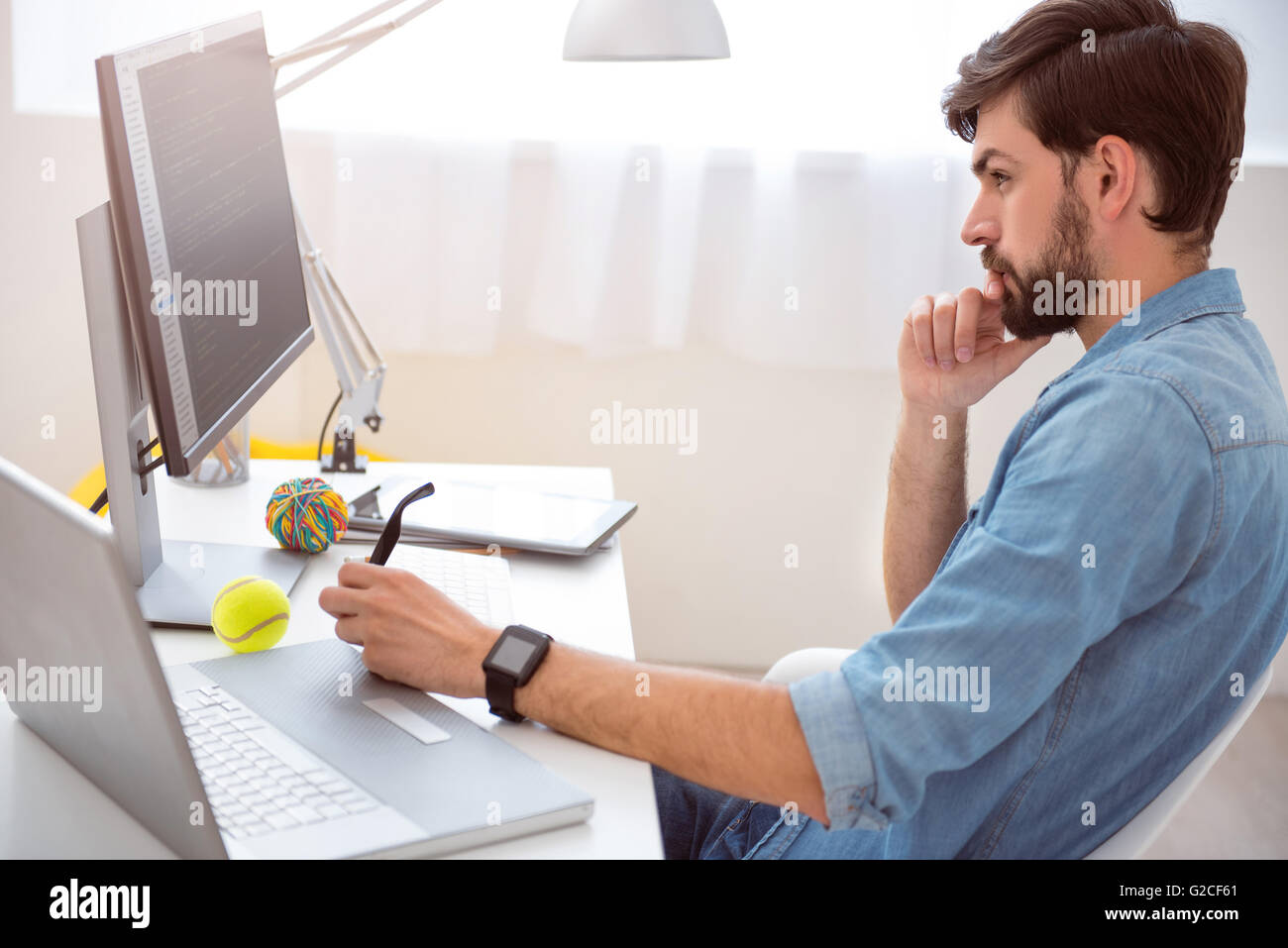 Man thinking in front of computer Stock Photo - Alamy