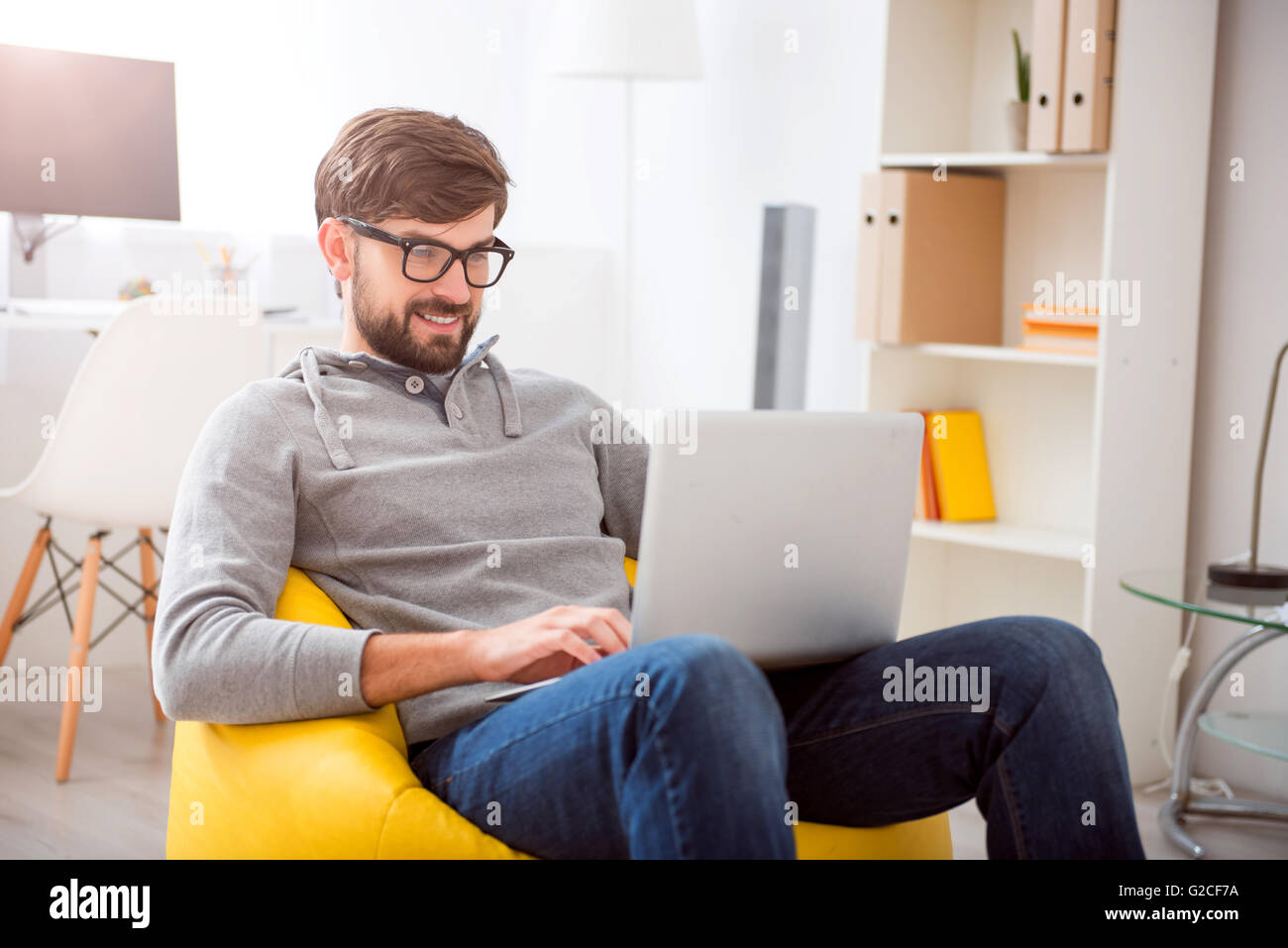 Man looking at the computer Stock Photo - Alamy