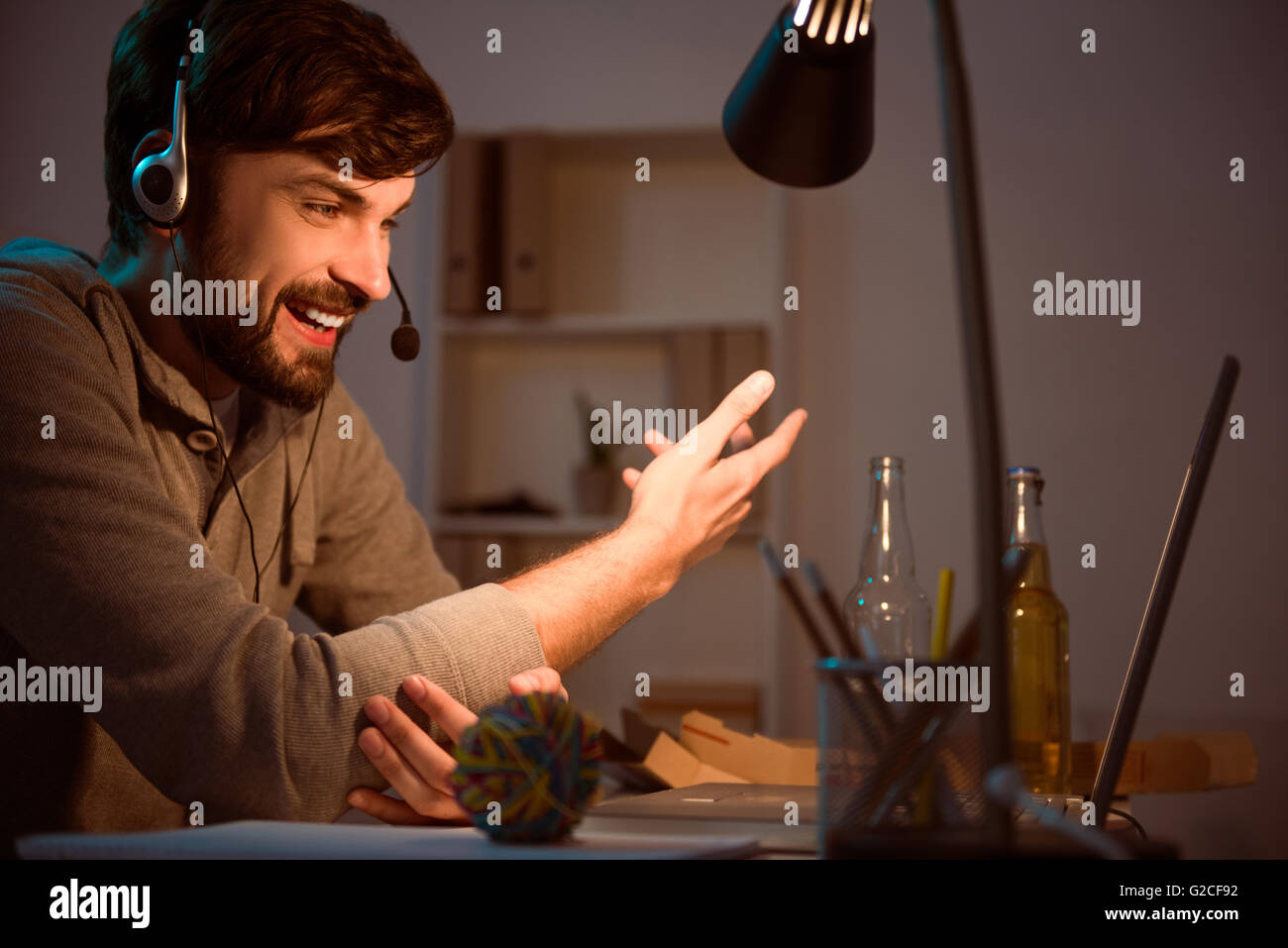 Man using headset and playing videogame Stock Photo - Alamy