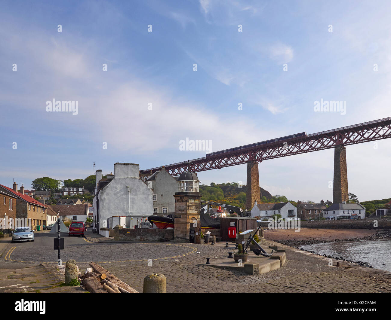 Firth of Forth railway bridge with train crossing viewed from North ...