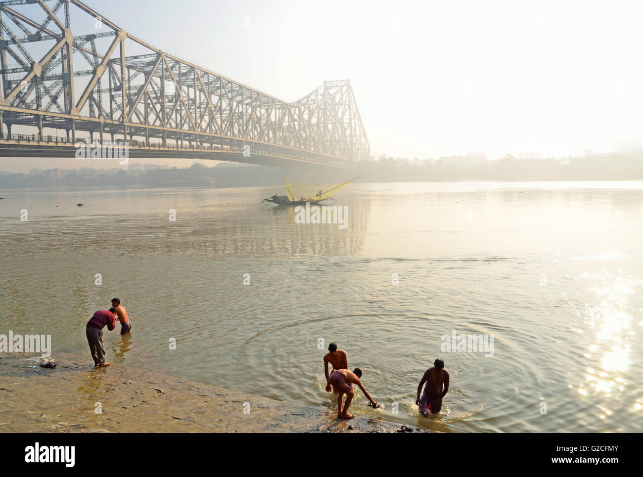Howrah Bridge at sunrise on a winter morning, Kolkata, West Bengal ...