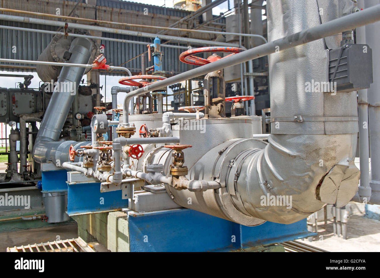 Industrial equipment and pipelines at the gas processing plant on a ...