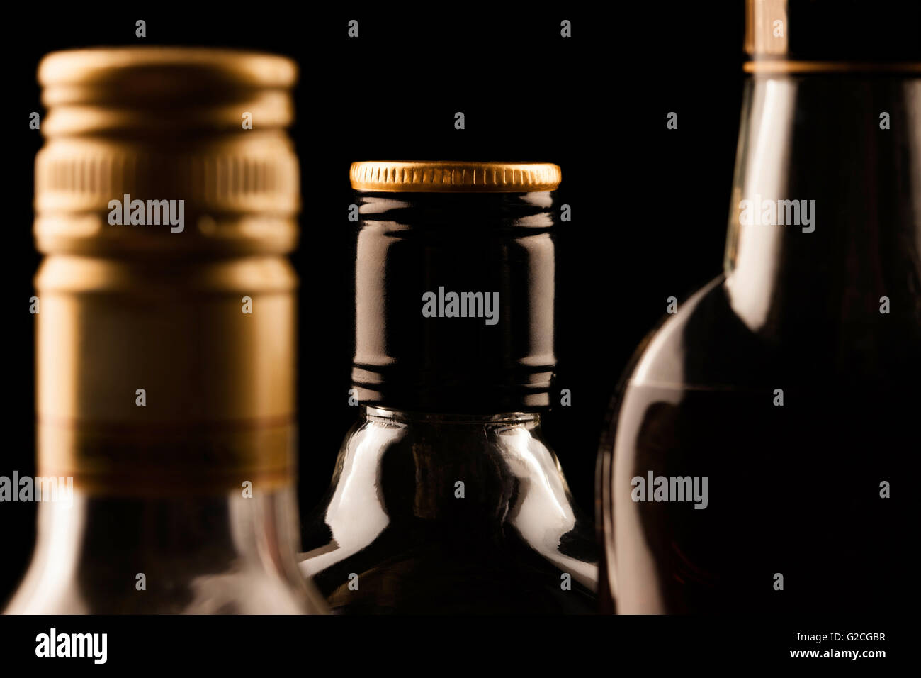 Alcohol bottles close-up background. Low aperture shot, focus on ...