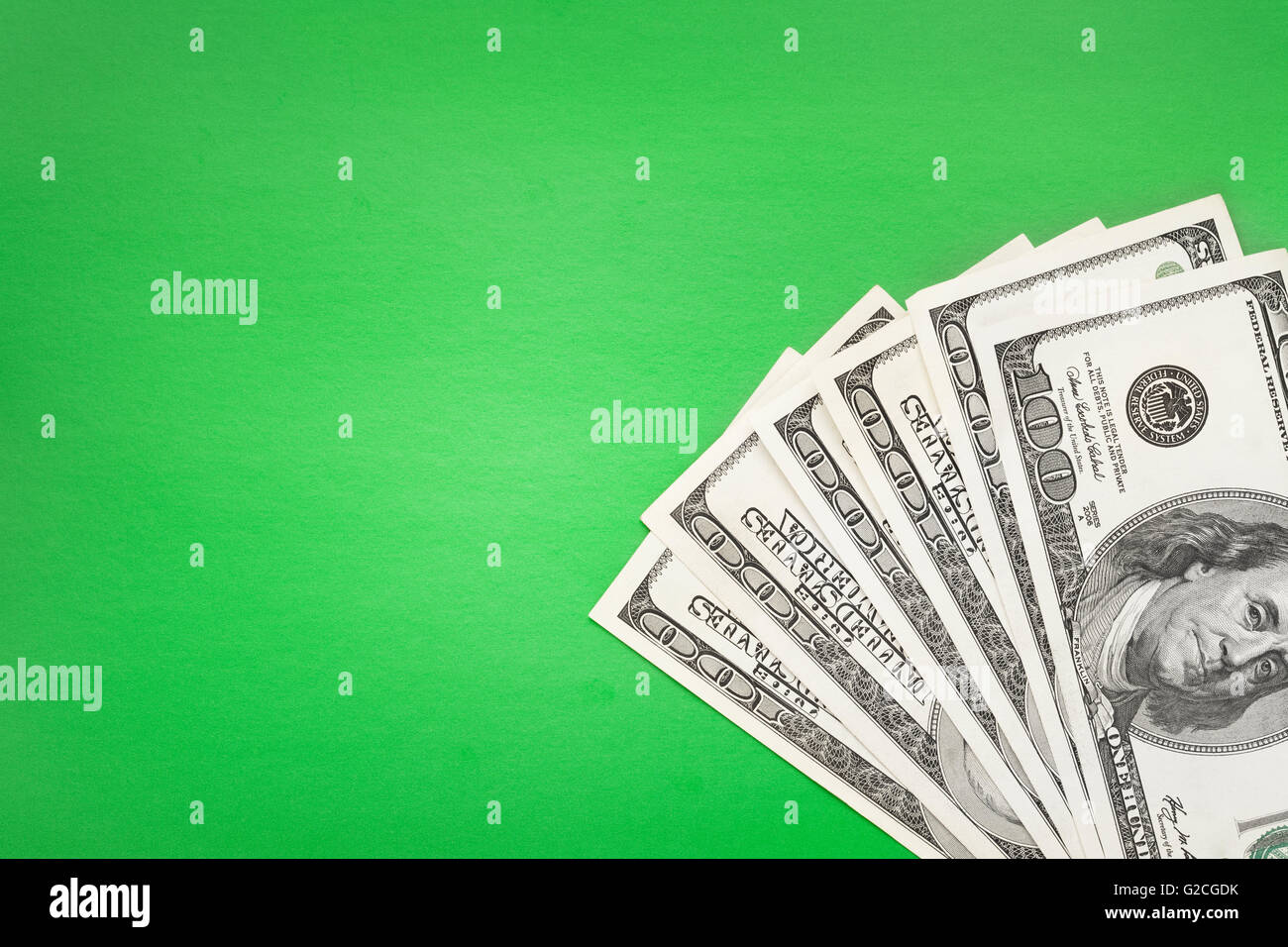 100$ banknotes lying in еру corner on green simple background Stock ...