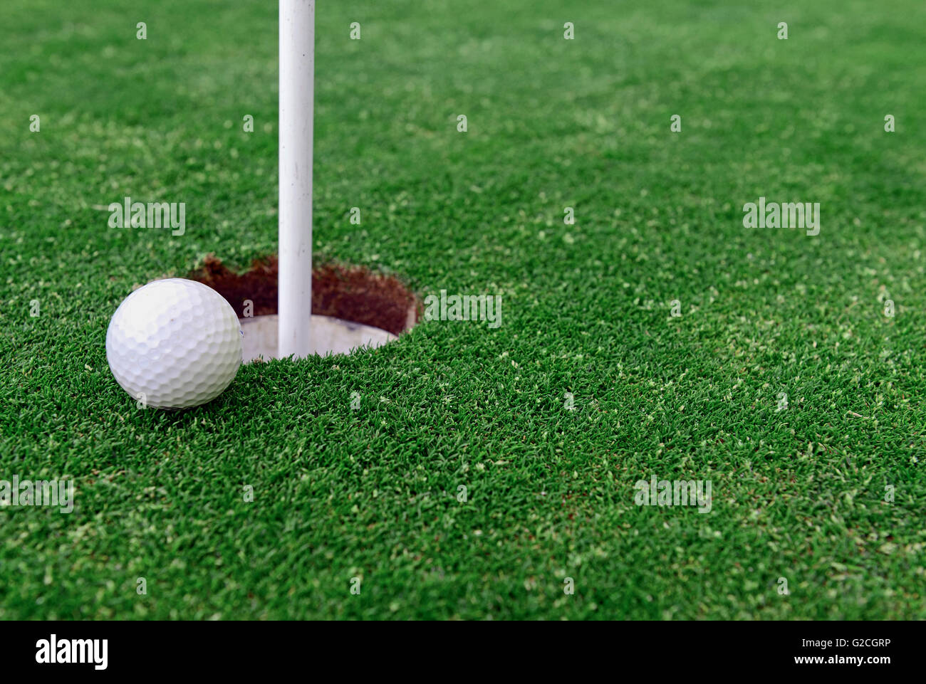 Golf ball and manicured grass of putting green on golf course Stock ...